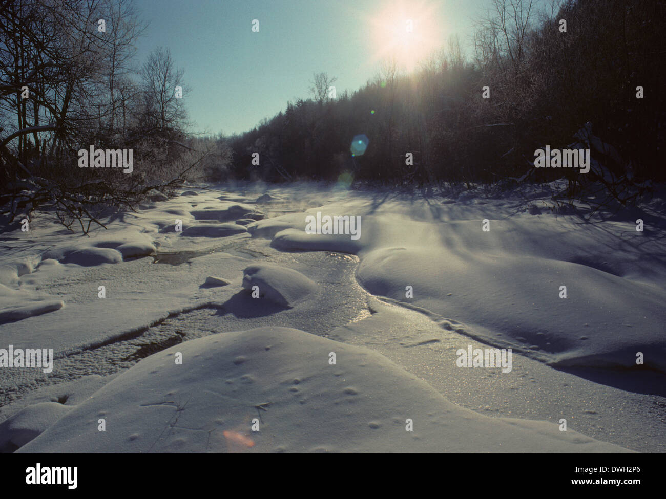 Frozen rocky river at sunrise, Tomifobia River, Beebe, Quebec, Canada ...