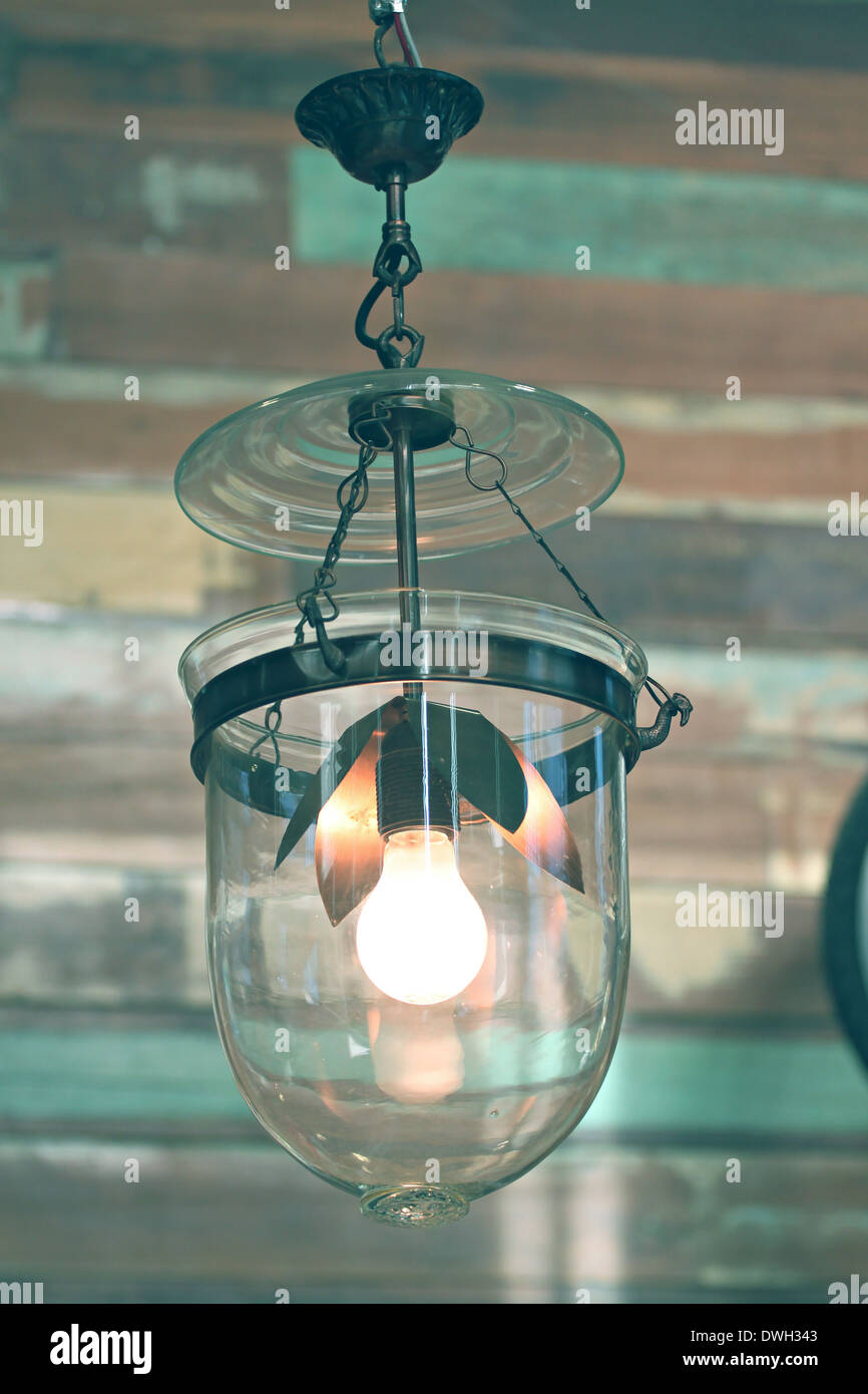 Ancient lamp of old wood background Stock Photo - Alamy