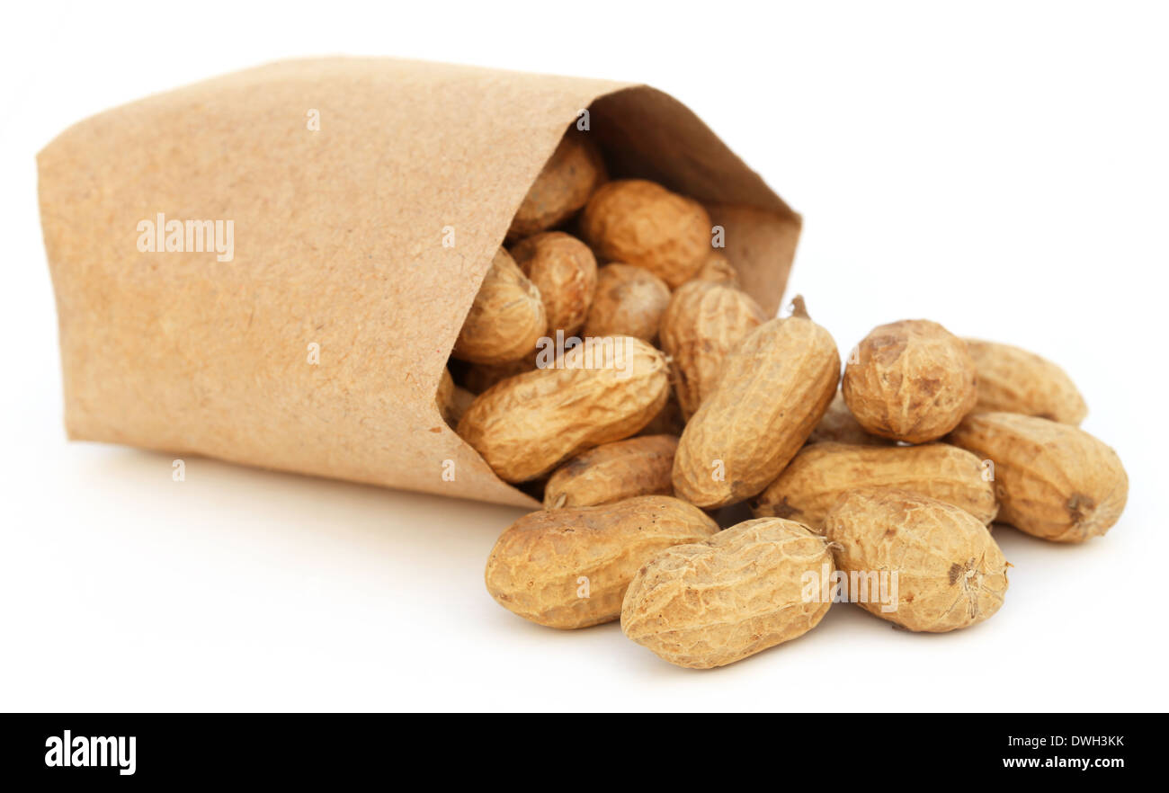 Peanuts in a packet over white background Stock Photo - Alamy