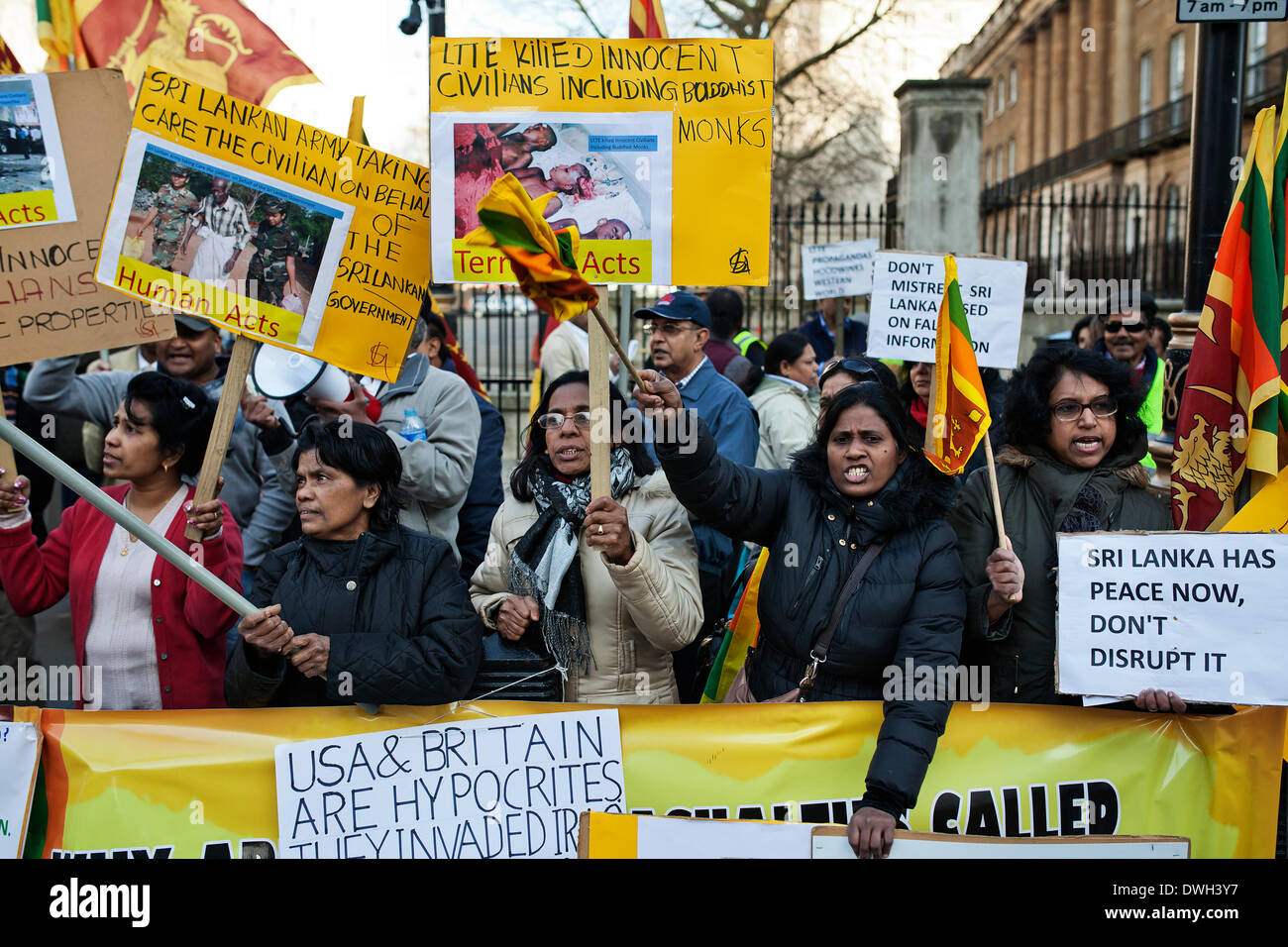 London, UK. 8th March 2014. People from Sri Lanka rally outside Downing ...