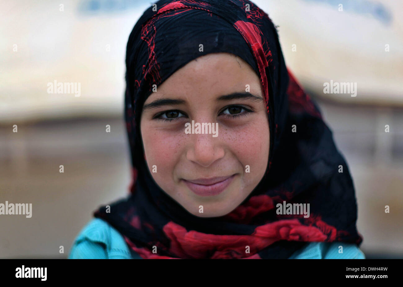 Amman, Jordan. 8th Mar, 2014. A Syrian girl poses for photos at Zaatari ...