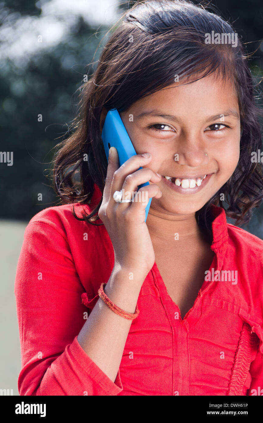 1 Indian kids talking with mobile Stock Photo - Alamy
