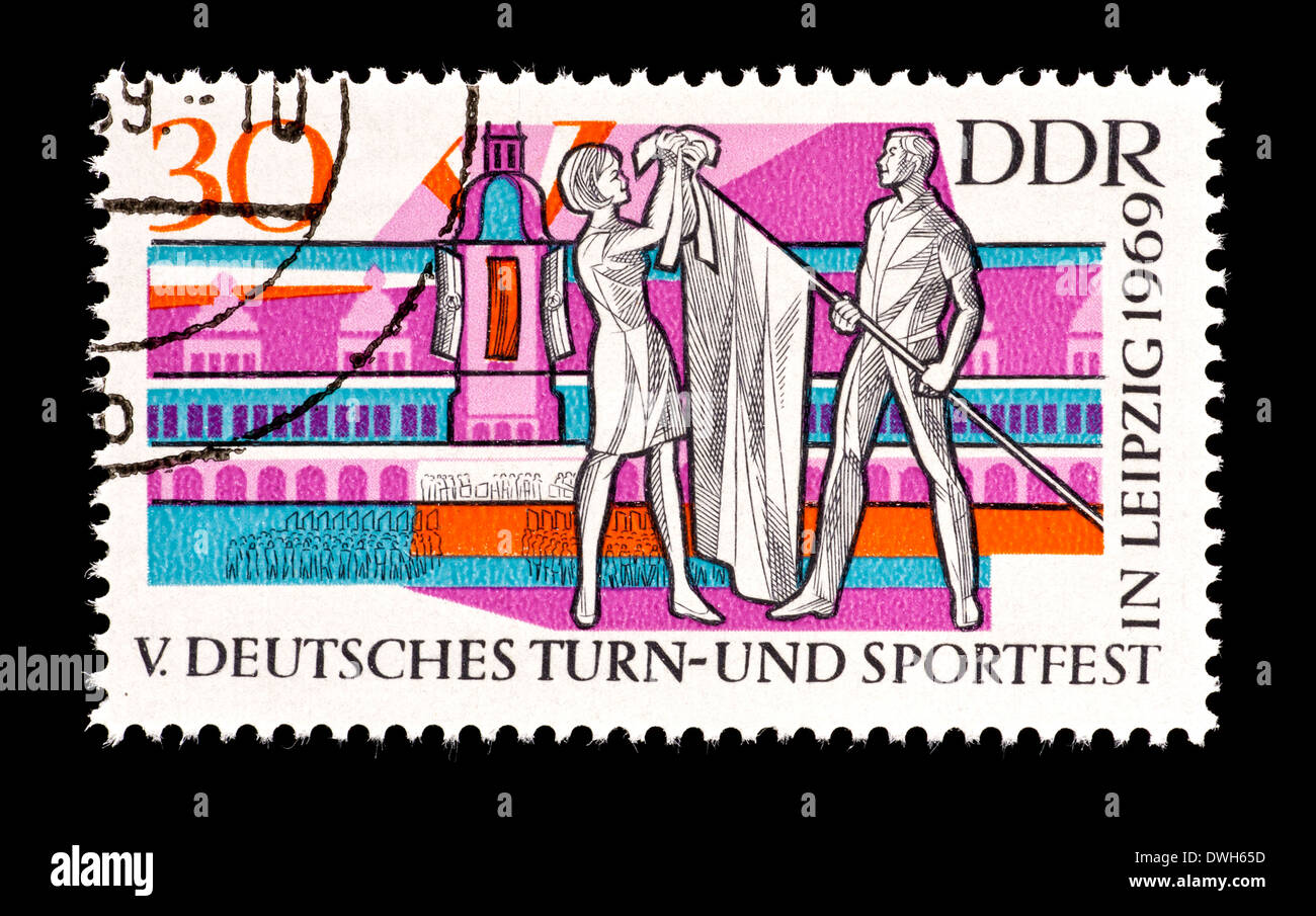 Postage stamp from East Germany (DDR) depicting presentation of colors ...