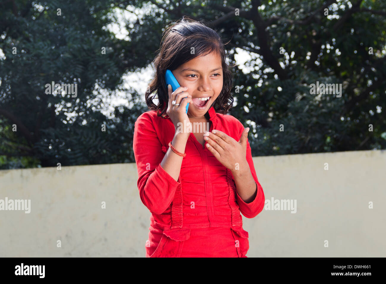 1 Indian kids talking with mobile Stock Photo - Alamy