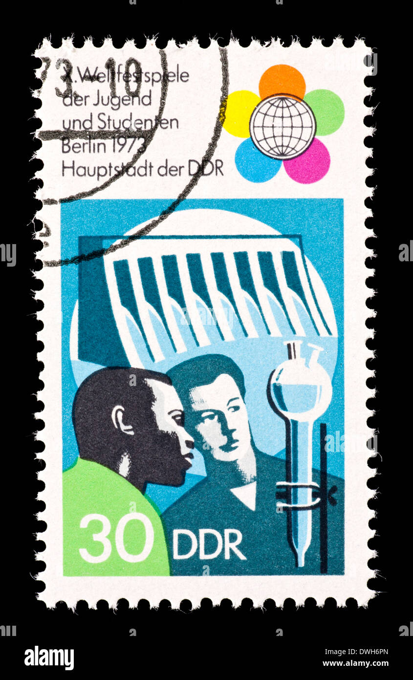 Postage stamp from East Germany (DDR) depicting students,dam and retort ...