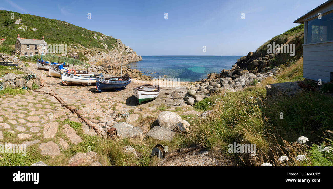 Fishing boats are moored up on the shore at Penberth Cove, Cornwall ...