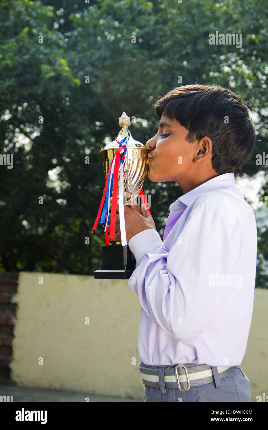 Standing holding side by side trophy achievement smiling looking away ...