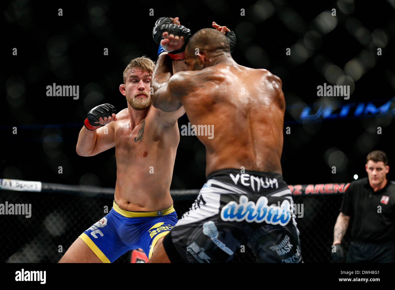 London, UK. 08th Mar, 2014. Alexander Gustafsson (blue trunks) fights ...