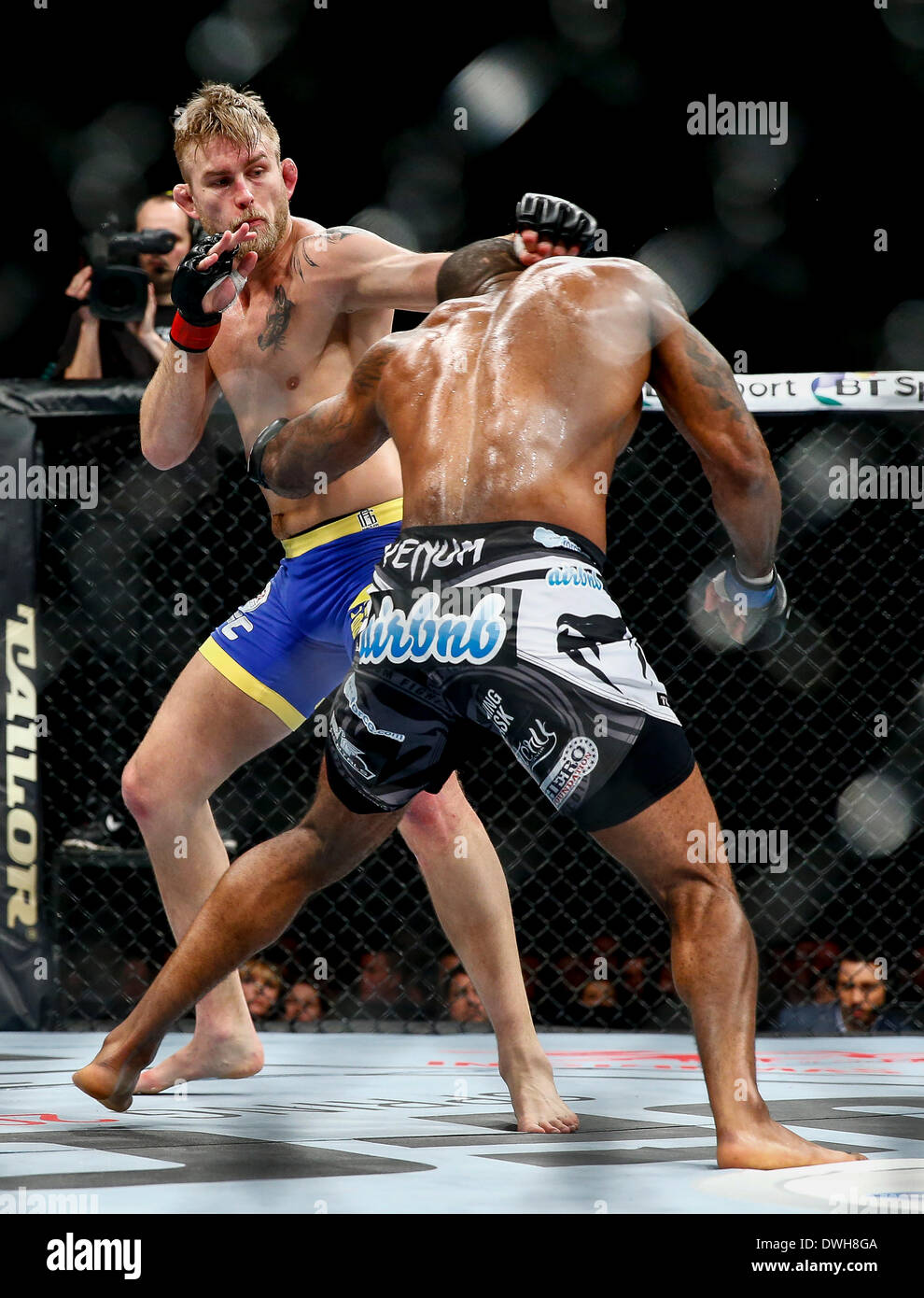 London, UK. 08th Mar, 2014. Alexander Gustafsson (blue trunks) fights ...