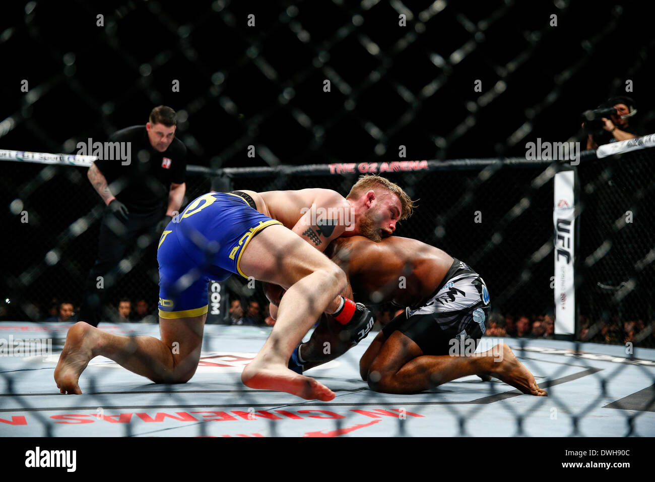 London, UK. 08th Mar, 2014. Alexander Gustafsson (blue trunks) fights ...