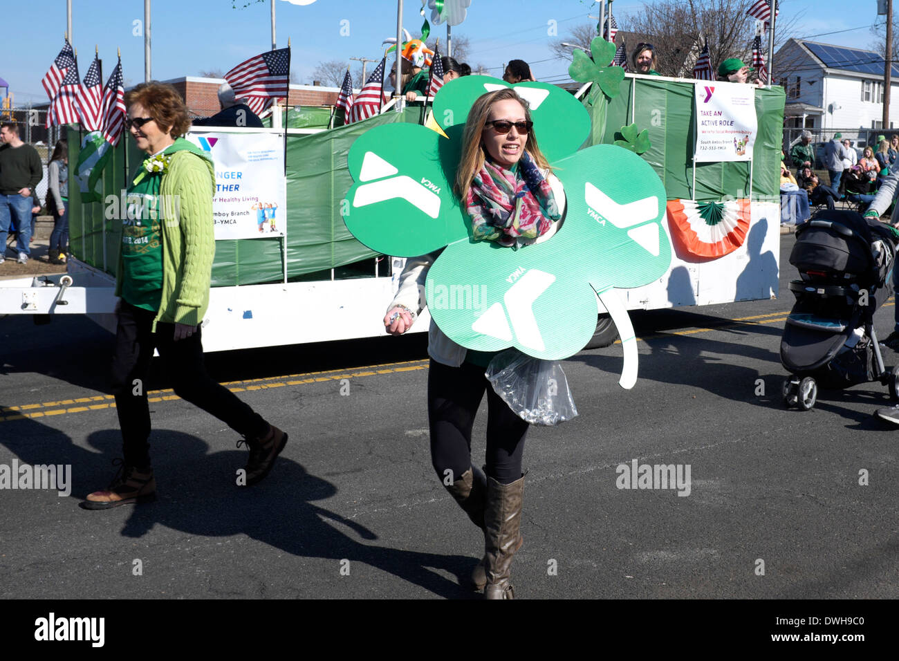 Woman marching in St Patrick's day parade wearing a Shamrock Stock ...