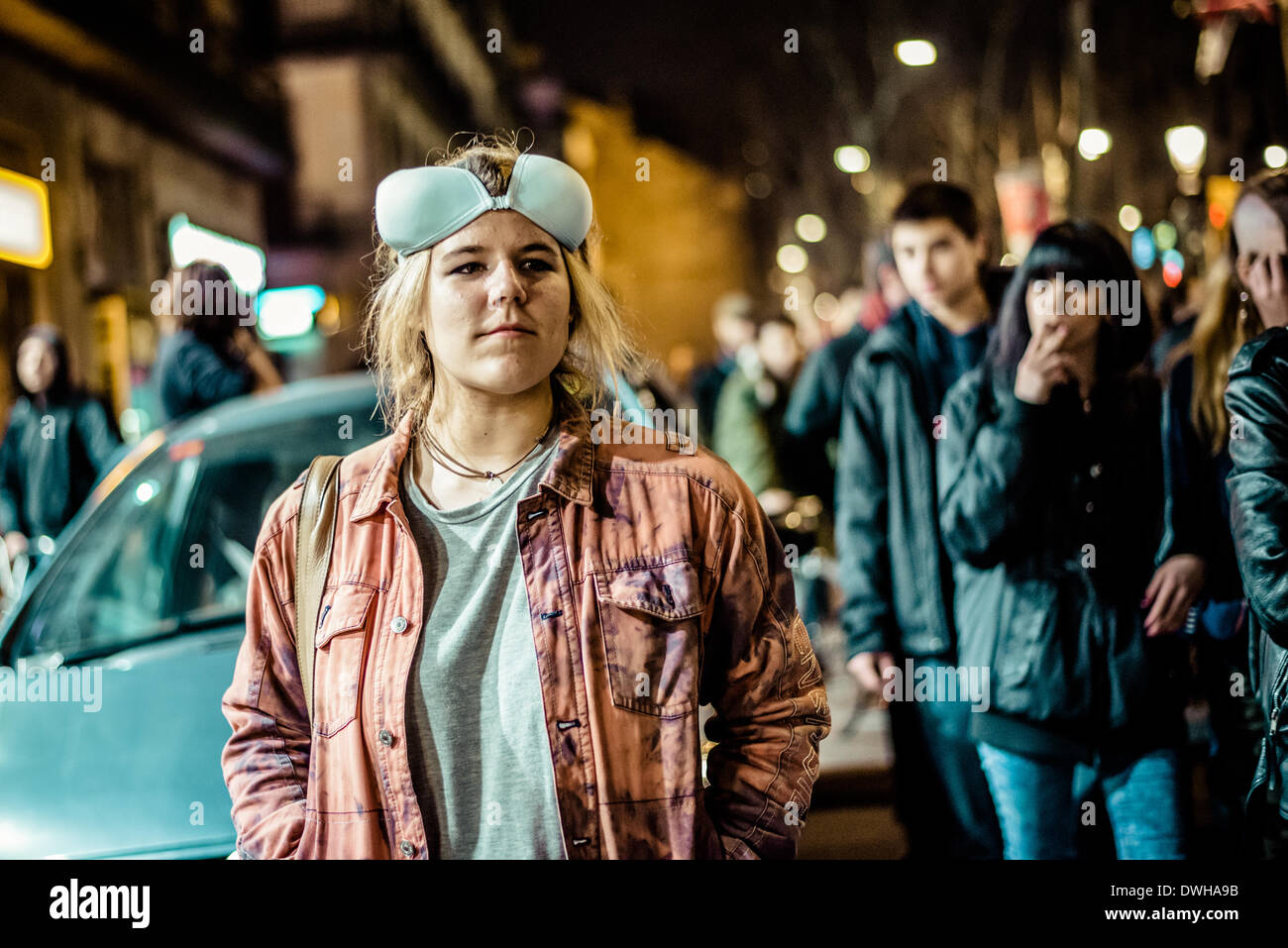 Barcelona, Spain. March 8th, 2014: An activist wears a bra on her head ...