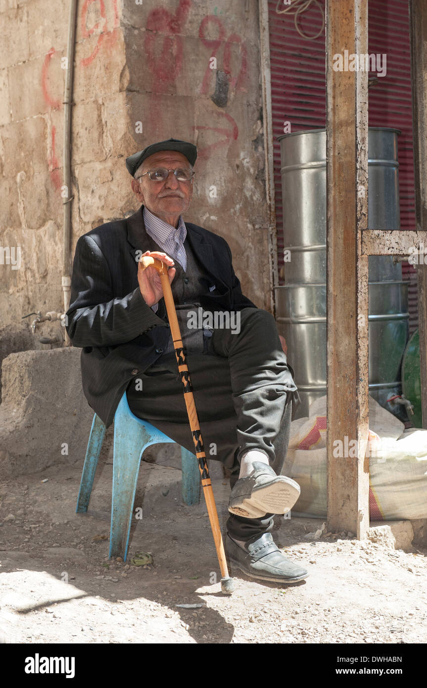 Man sitting on plastic chair hi-res stock photography and images - Alamy