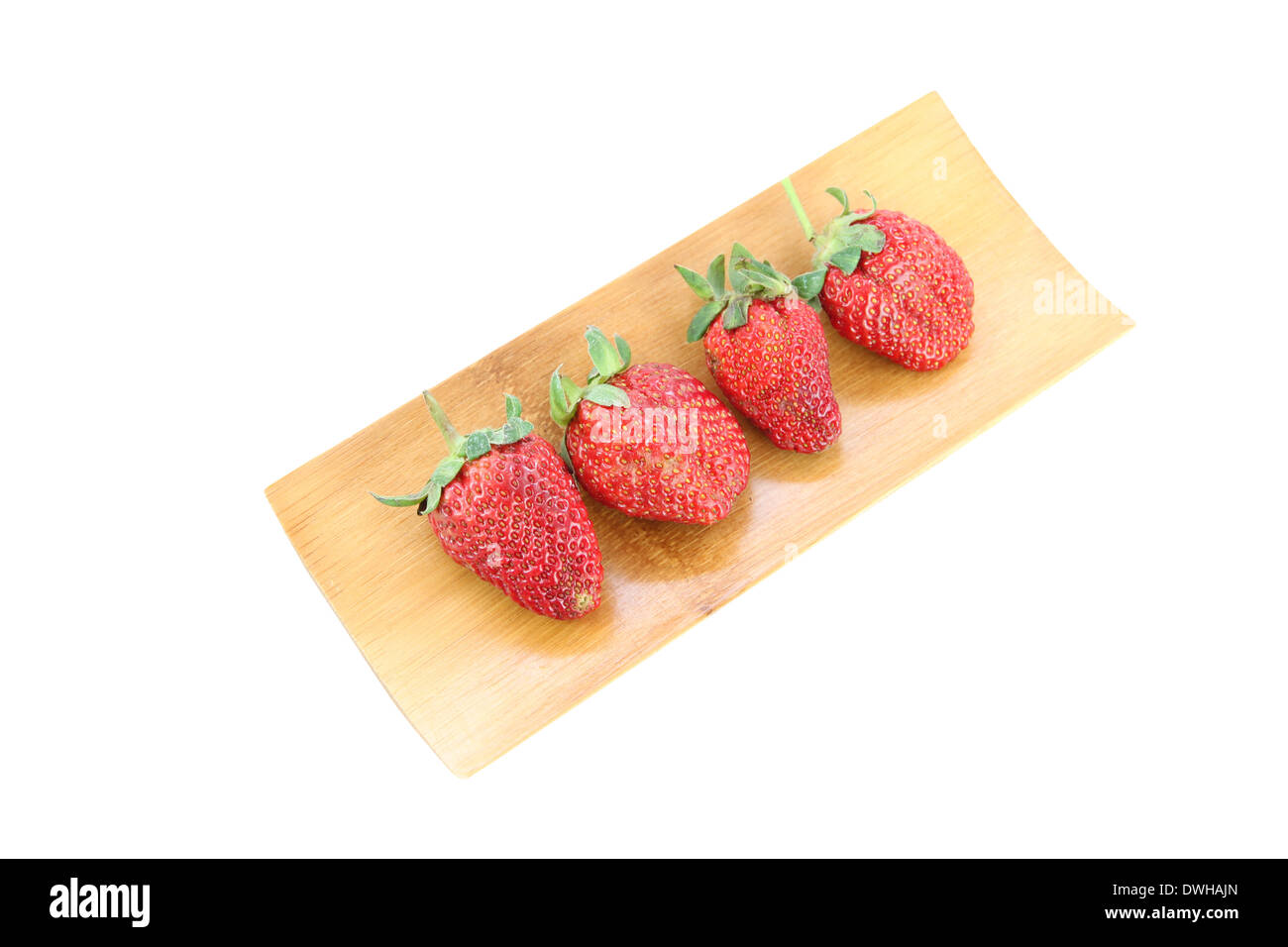 Four Strawberry in bamboo dish on white background Stock Photo - Alamy