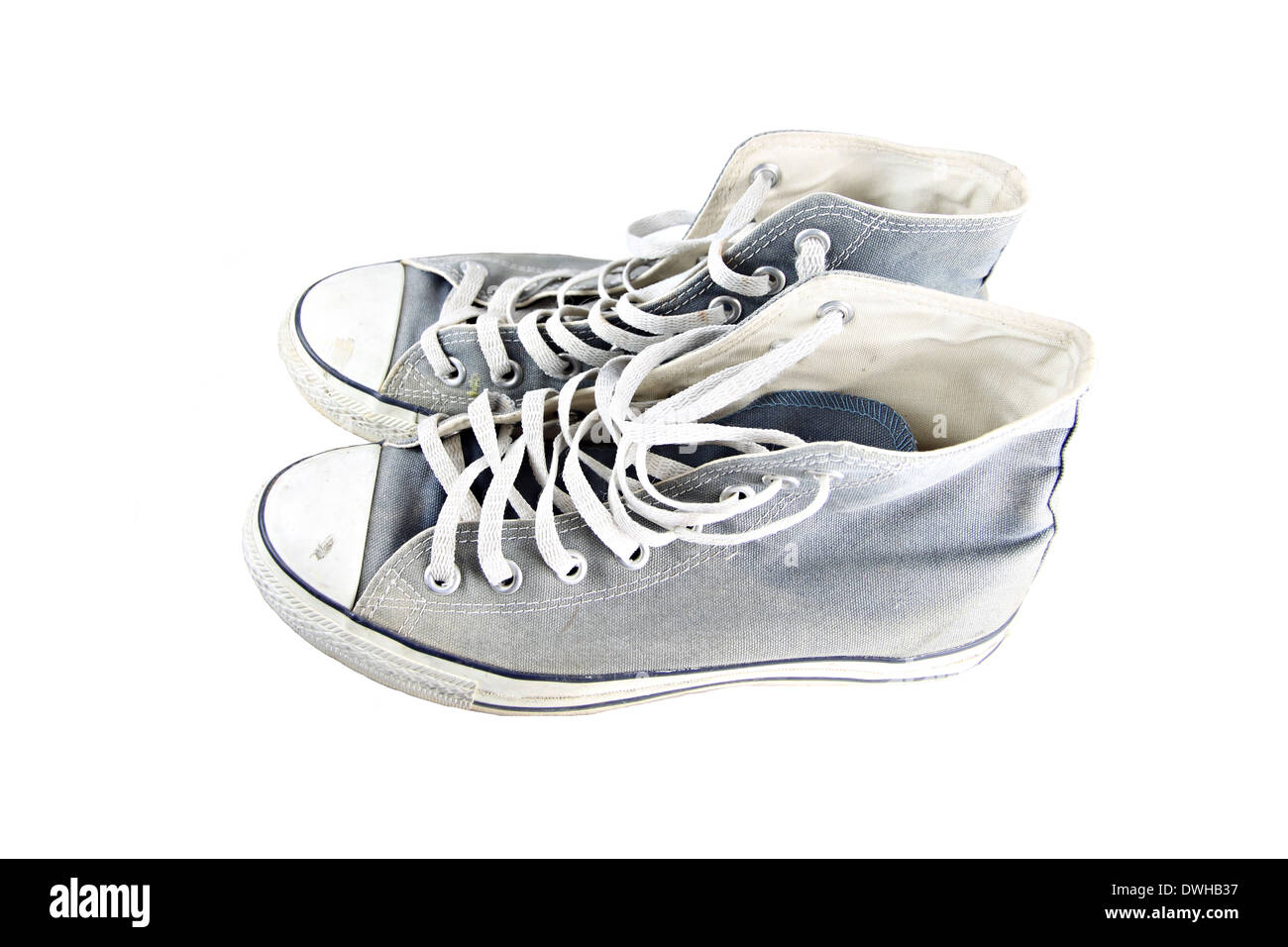 Dirty gray sneaker isolated on white background Stock Photo - Alamy