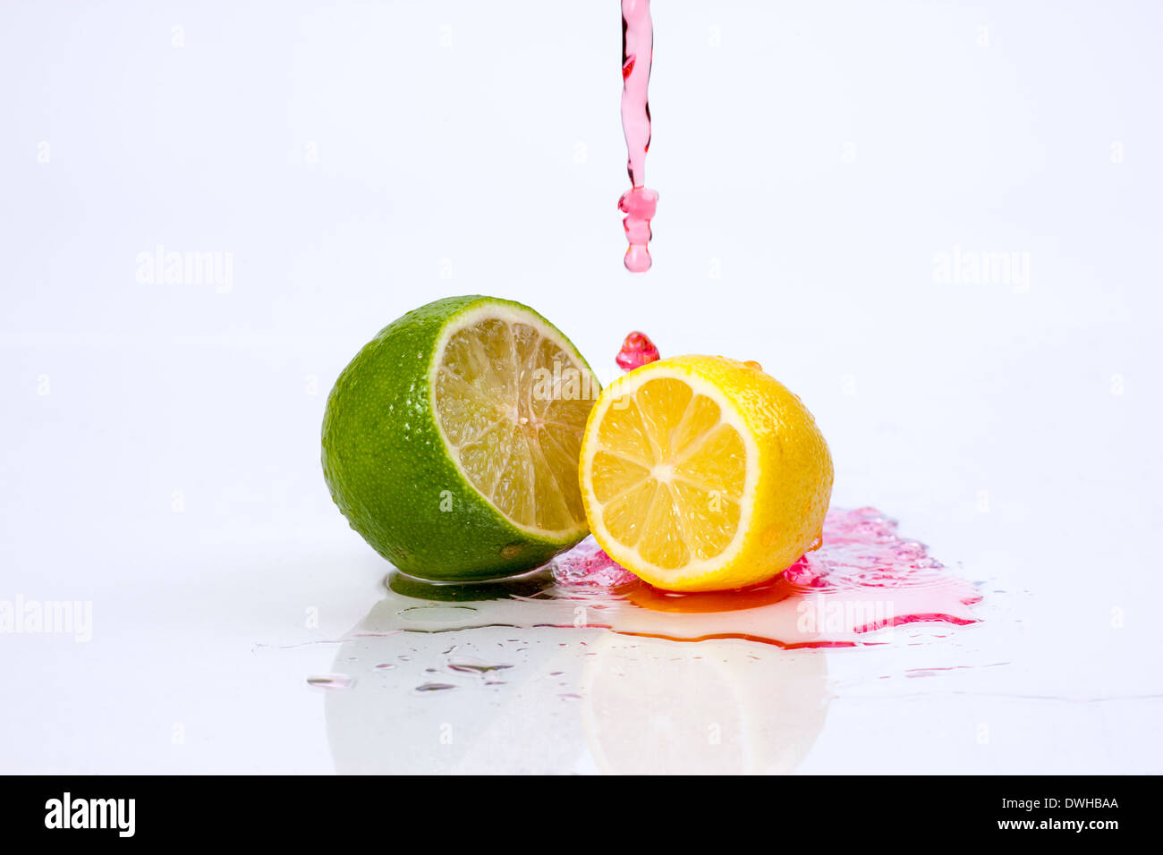 Red liquid on lemon and lime Stock Photo - Alamy