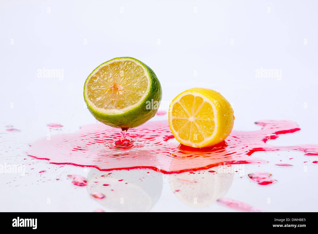 Lemon and lime makes a splash Stock Photo - Alamy