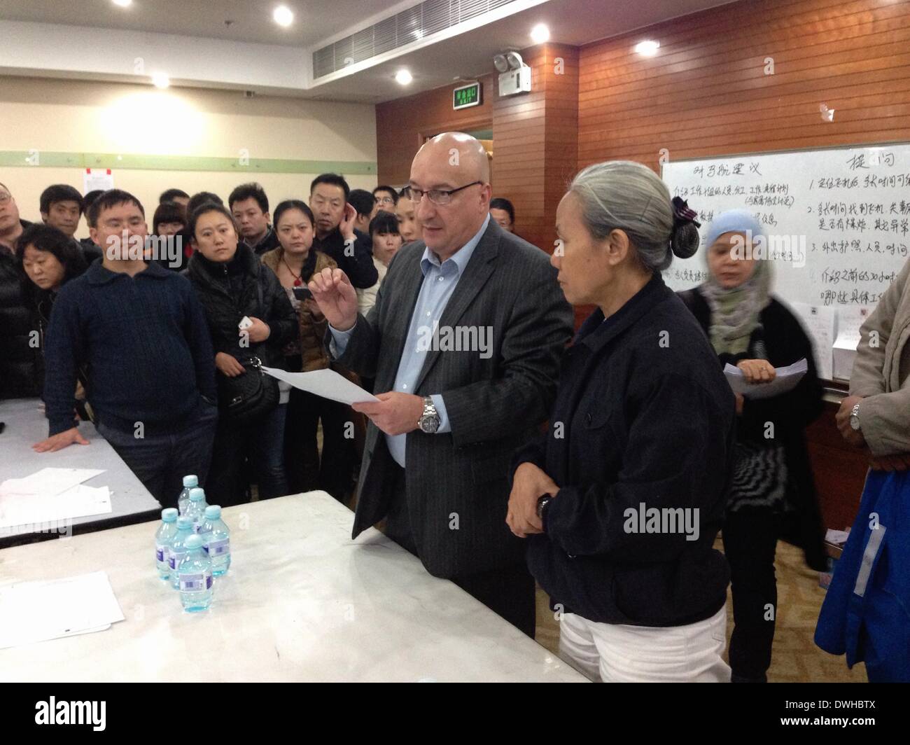 Beijing, China. 9th Mar, 2014. Hugh Dunleavy (2nd R), director of ...