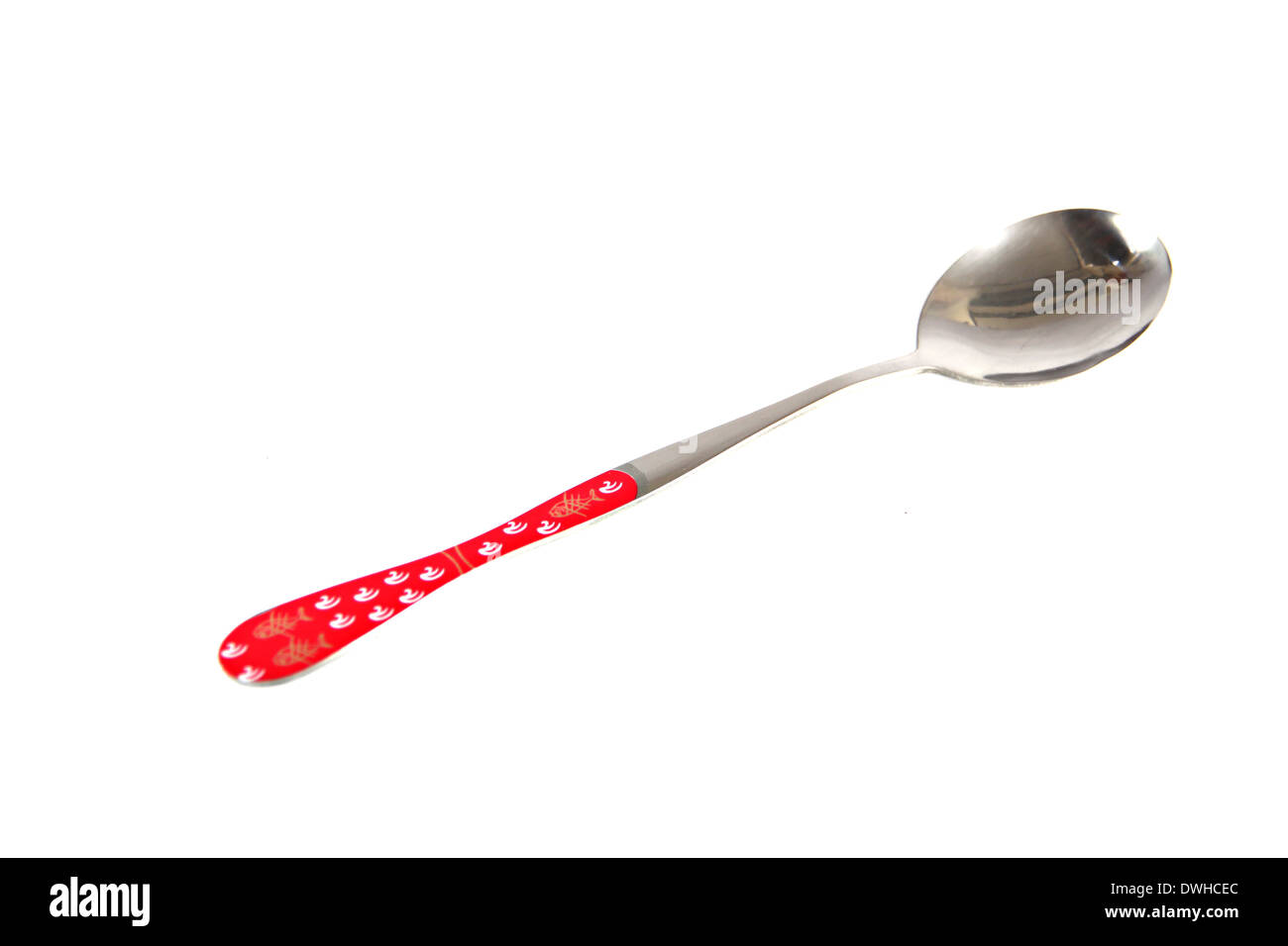 Stainless steel spoon with red pattern on white background Stock Photo ...