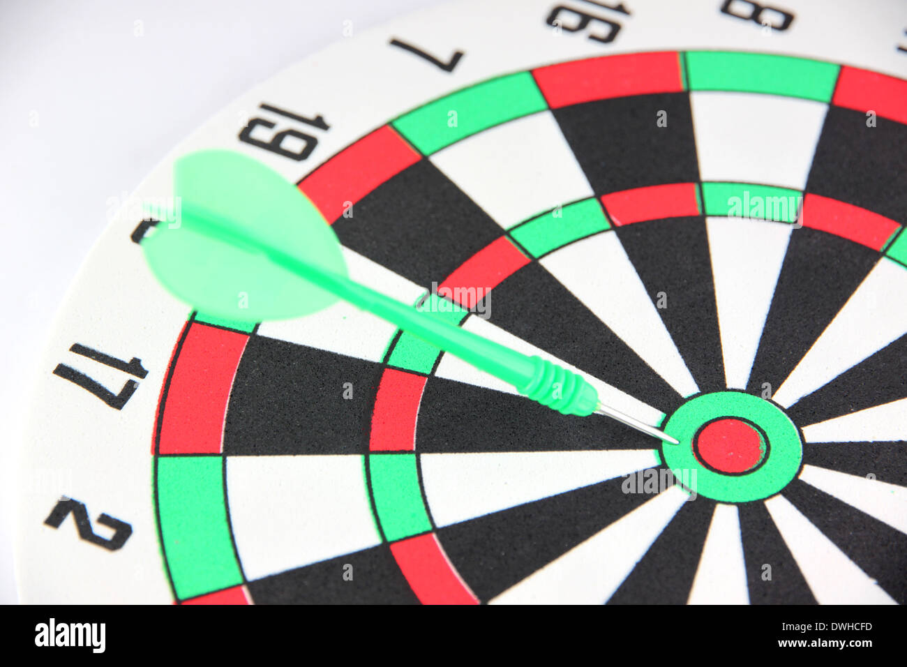 Green Darts on Target Stock Photo - Alamy