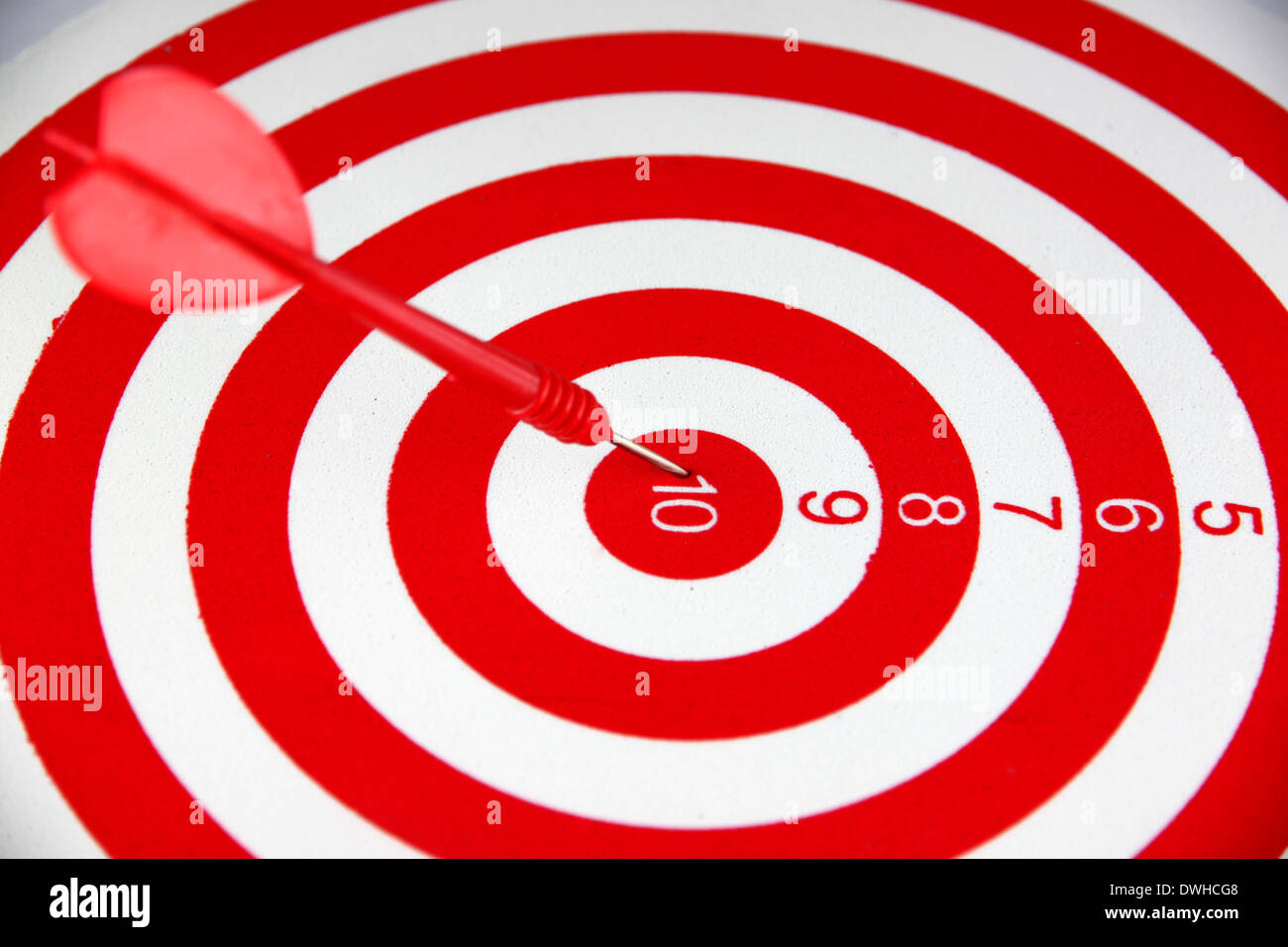 Red Darts on Target Stock Photo - Alamy