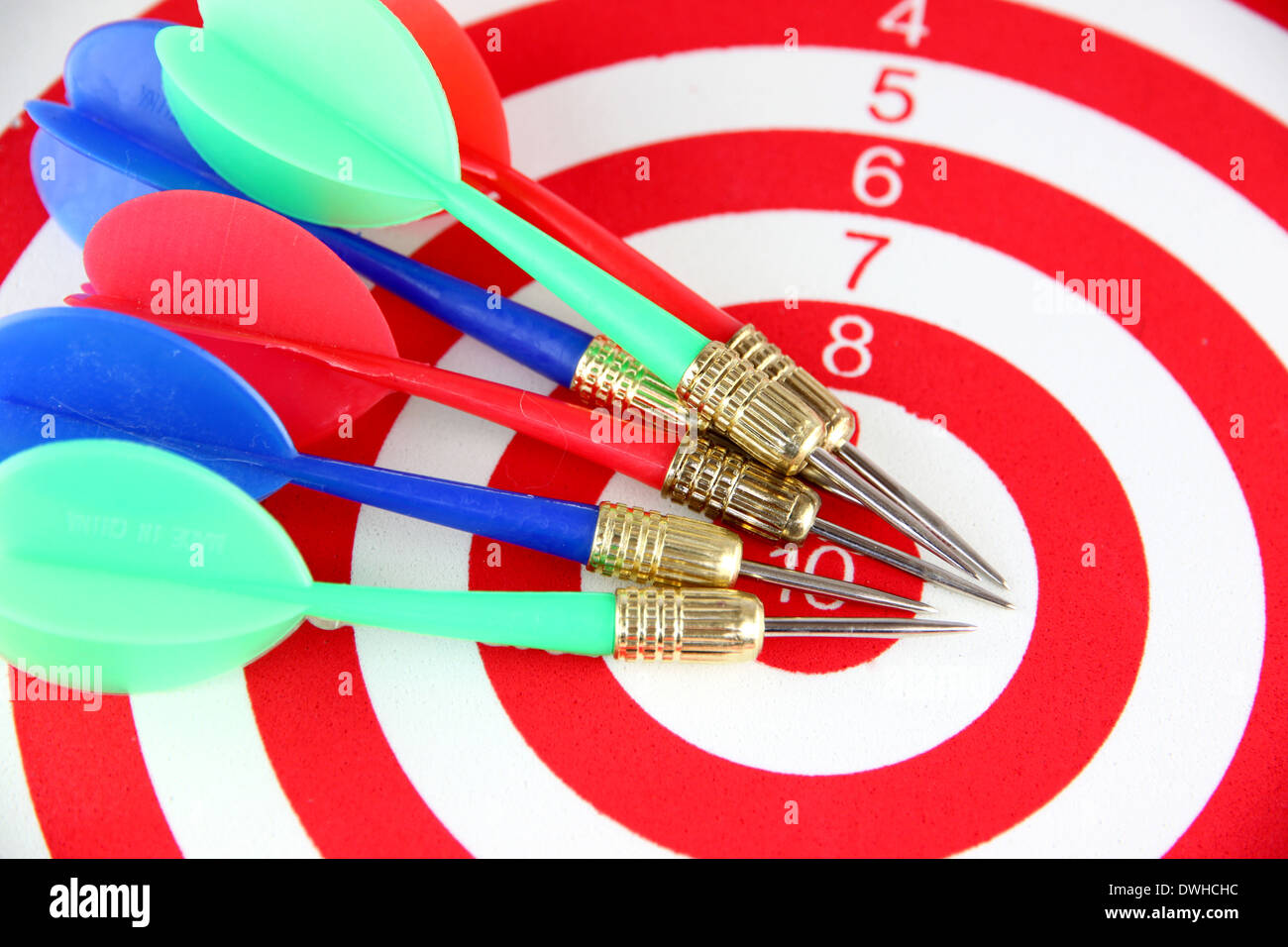 Many Darts on board Stock Photo - Alamy