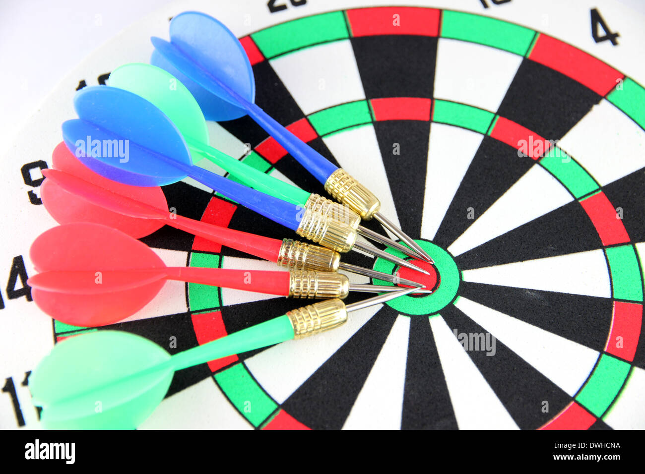 Many Darts on board Stock Photo - Alamy