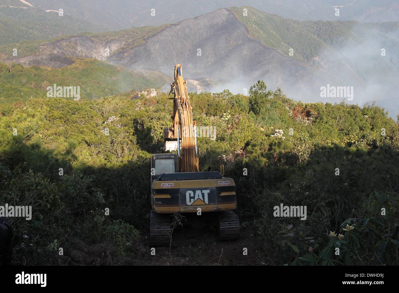 Kunming, China's Yunnan Province. 9th Mar, 2014. An excavator works at ...
