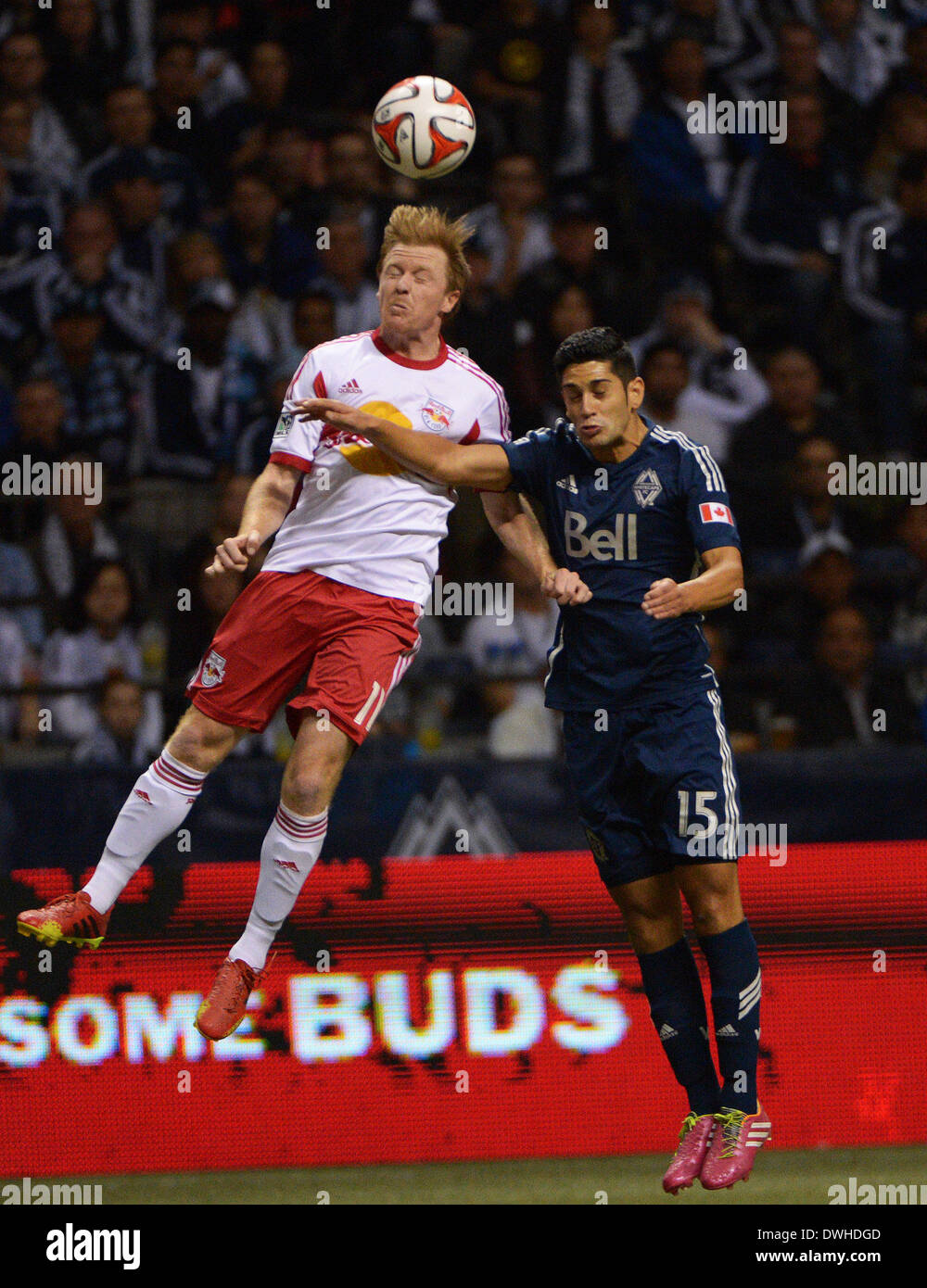 Vancouver, Canada. 8th Mar, 2014. Vancouver Whitecaps' Matias Laba (R ...