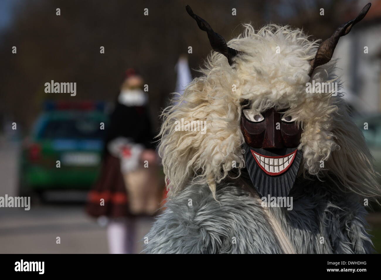 Mohacs, Hungary. 4th Mar, 2014. Buso in traditional wooden mask with a ...