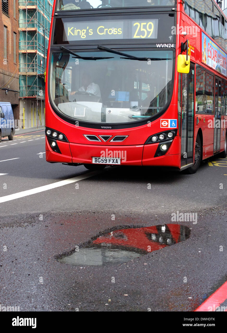 Pothole . . London, UK. 8th March, 2014. A big pothole has filled with ...