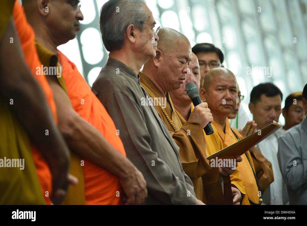 Kuala Lumpur, Malaysia. 9th Mar, 2014. A Buddhist priest hosts a prayer ...