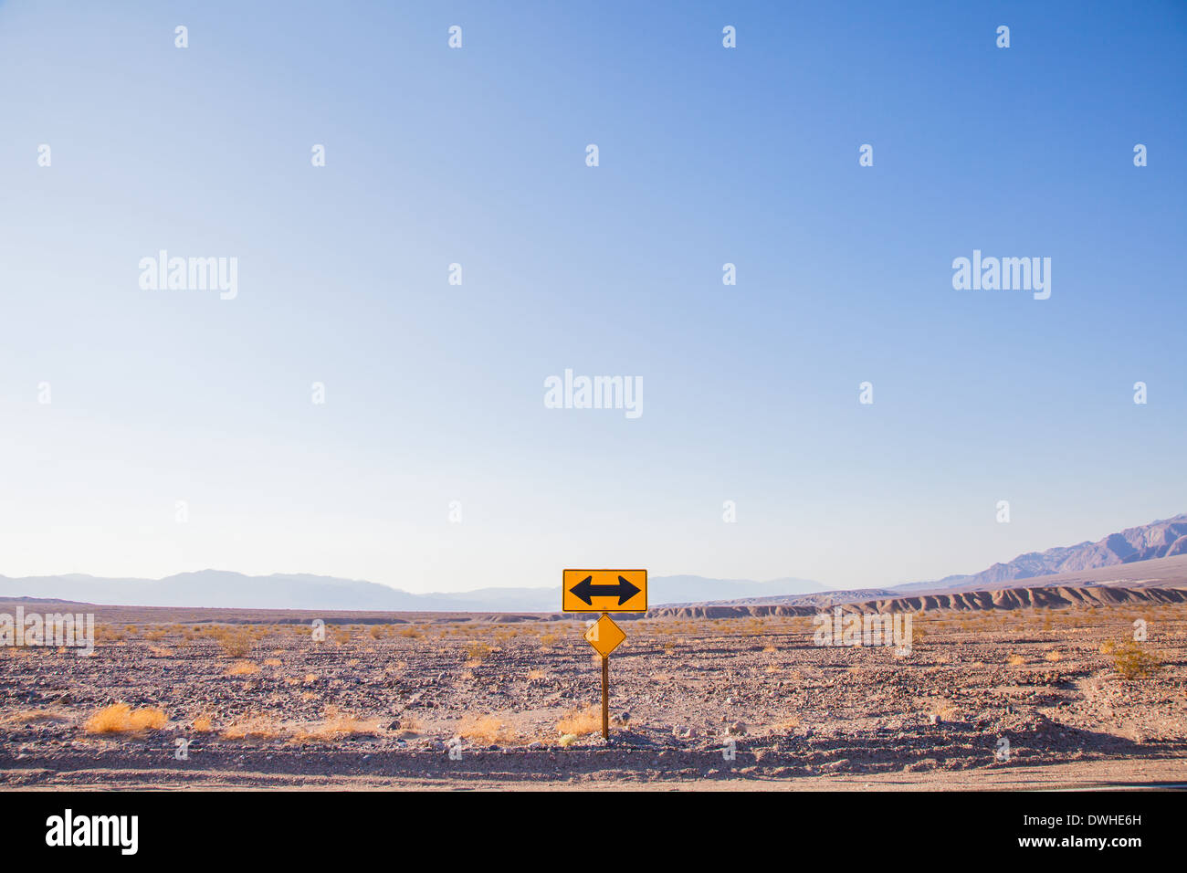Death Valley, California. Direction sign in the middle of the desert ...