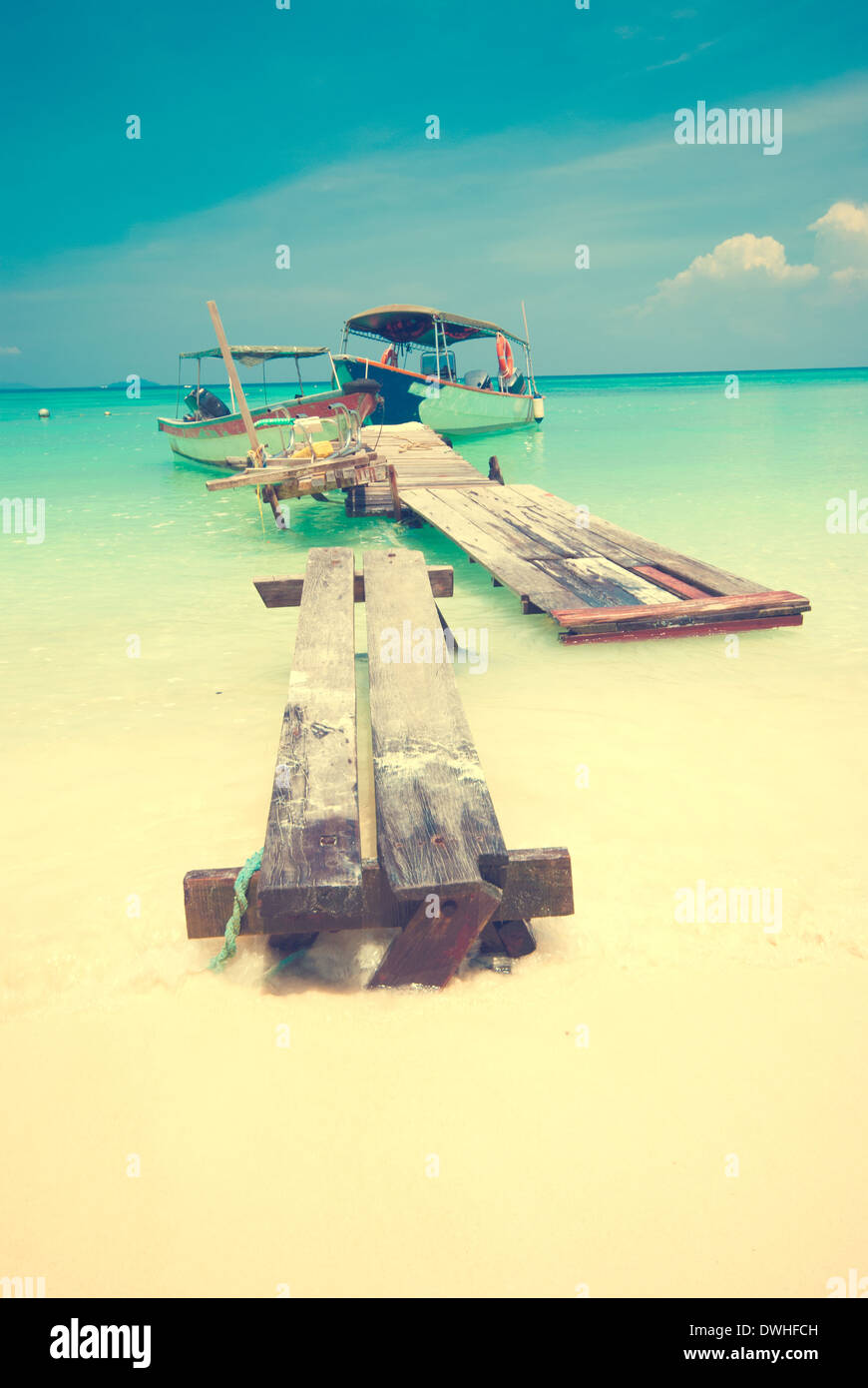 pier on a beach vintage retro effects Stock Photo - Alamy