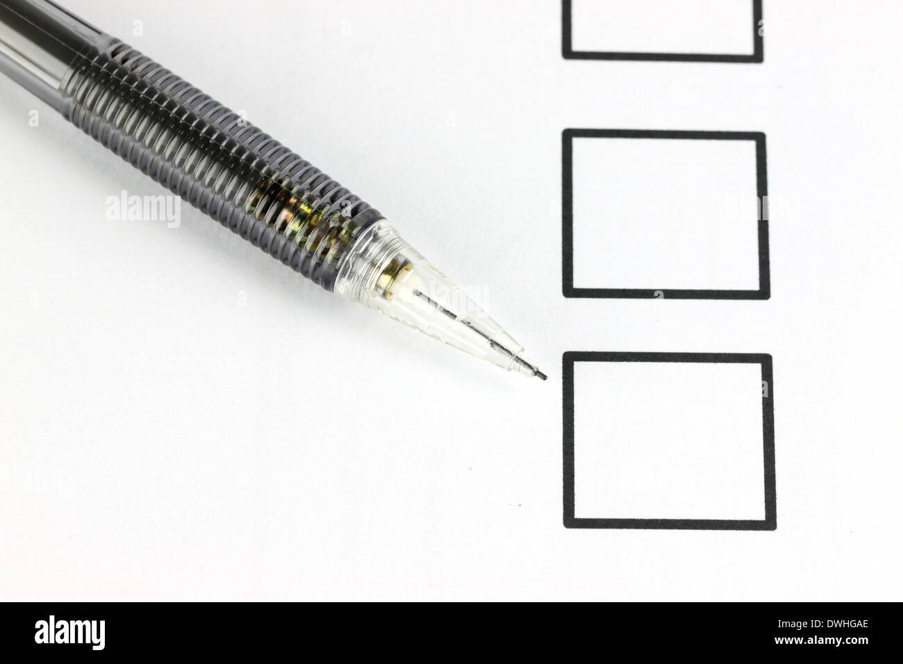 Mechanical pencil point to checkbox on white background Stock Photo - Alamy