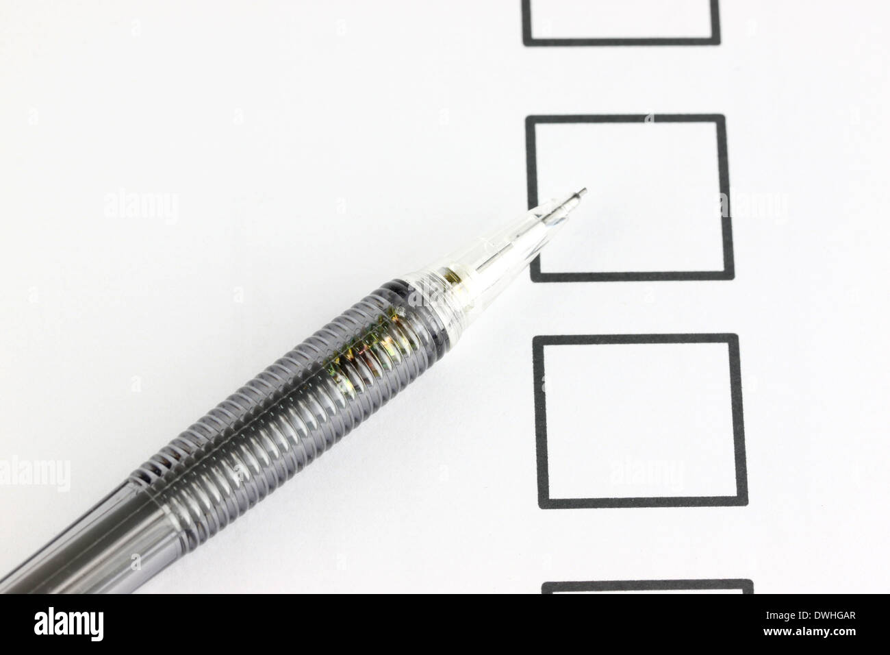 Mechanical pencil point to checkbox on white background Stock Photo - Alamy