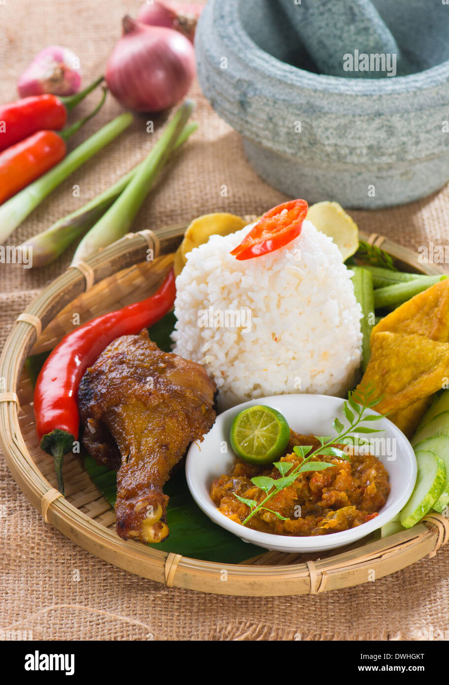 indonesian fried chicken rice on traditional background Stock Photo - Alamy