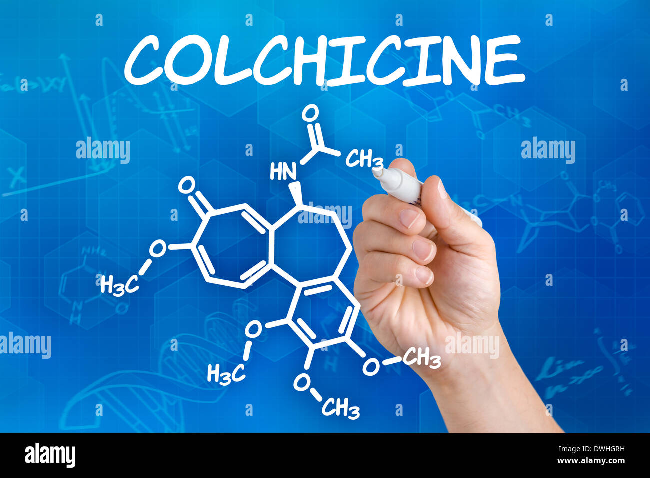 Hand with pen drawing the chemical formula of colchicine Stock Photo ...