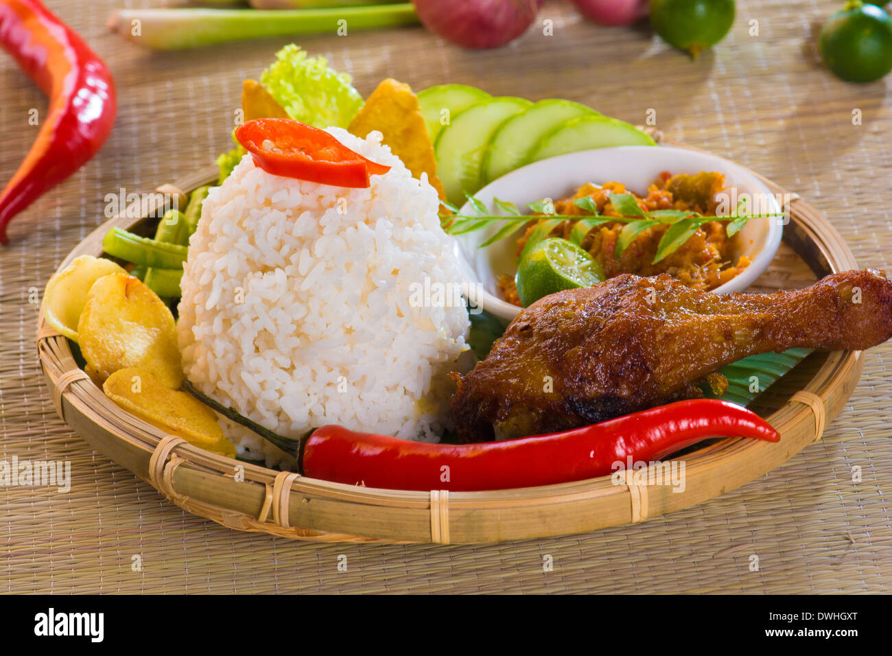 indonesian fried chicken rice on traditional background Stock Photo - Alamy