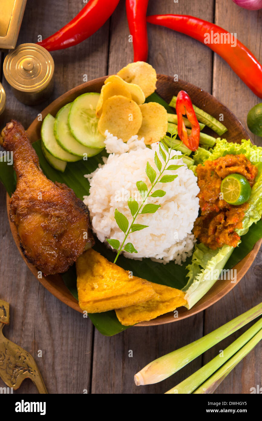 indonesian fried chicken rice on traditional background Stock Photo - Alamy