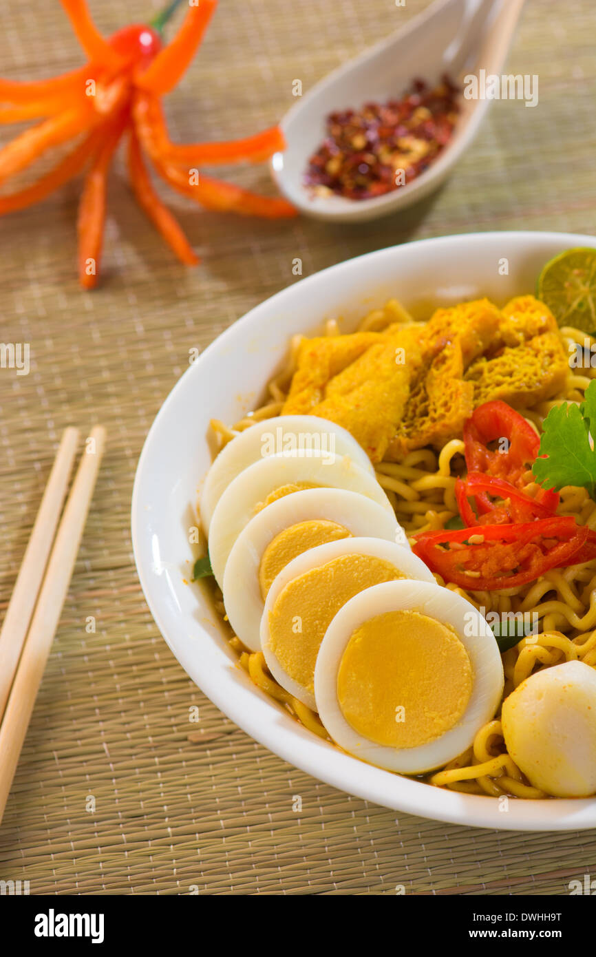 Hot and spicy Singapore Curry Noodle with decoration setup Stock Photo ...