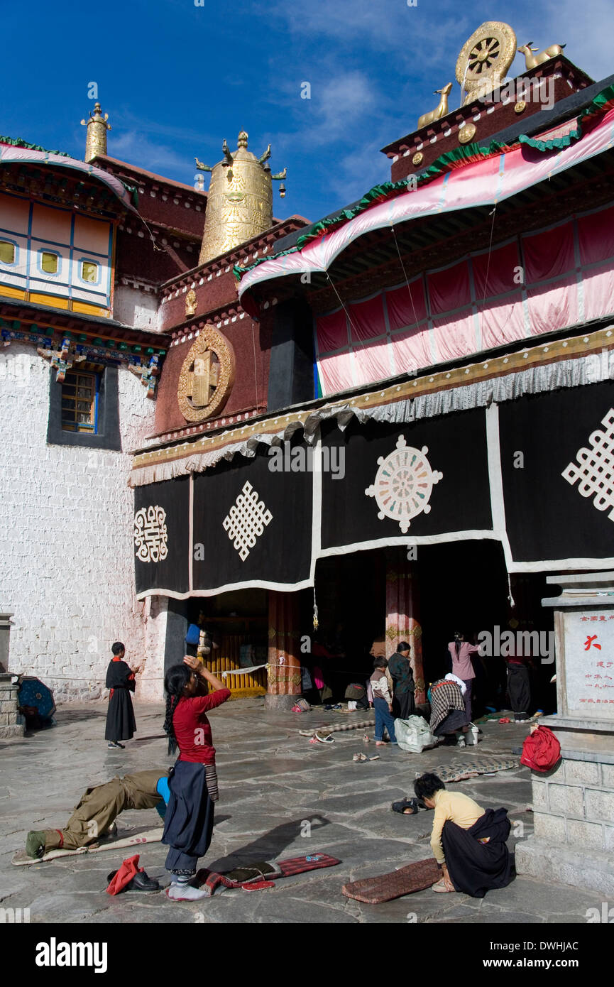 Pilgrims at the Jokhang Buddhist Temple in the city of Lhasa in Tibet ...