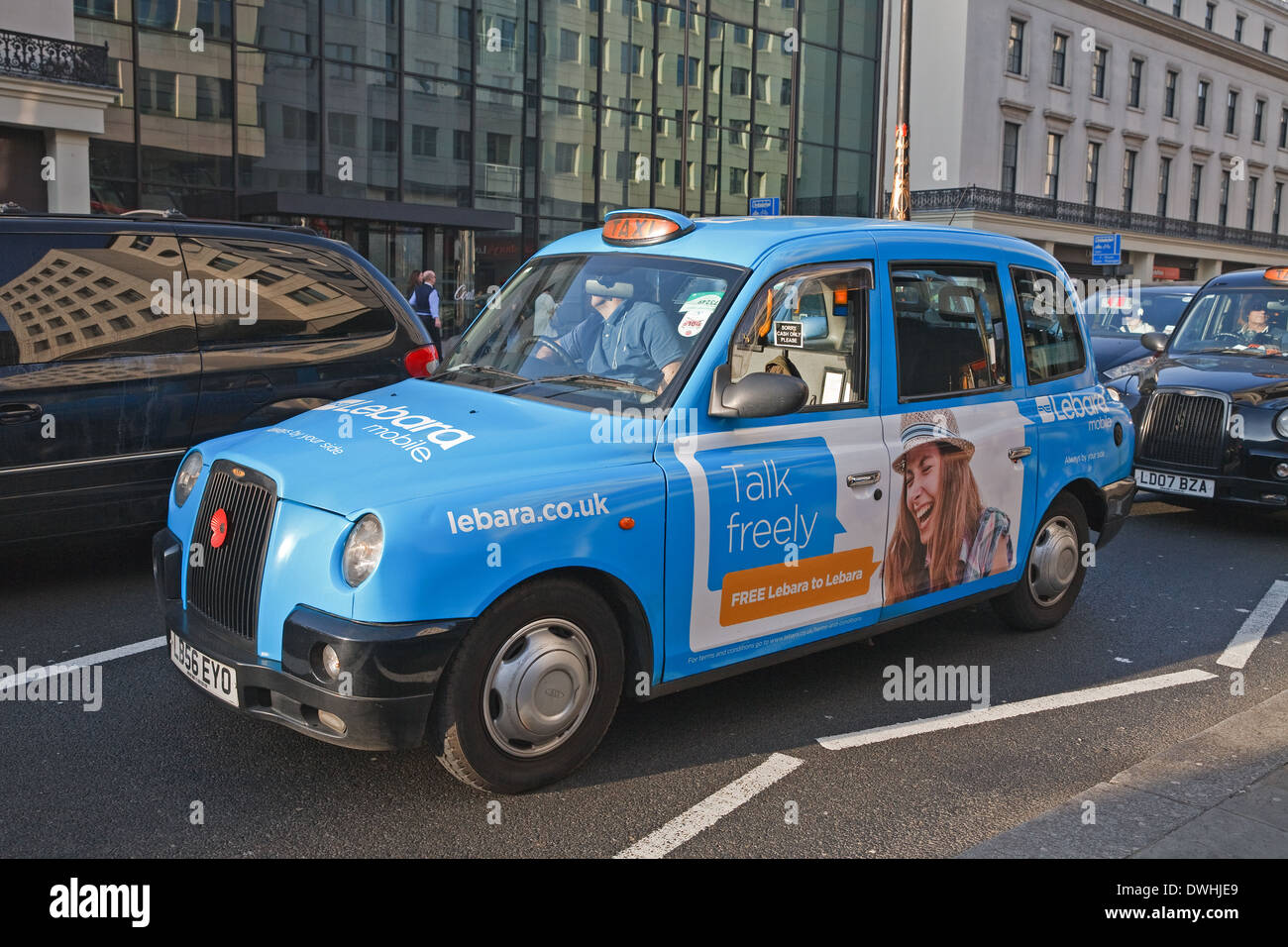 A blue London Taxi in central London Stock Photo - Alamy