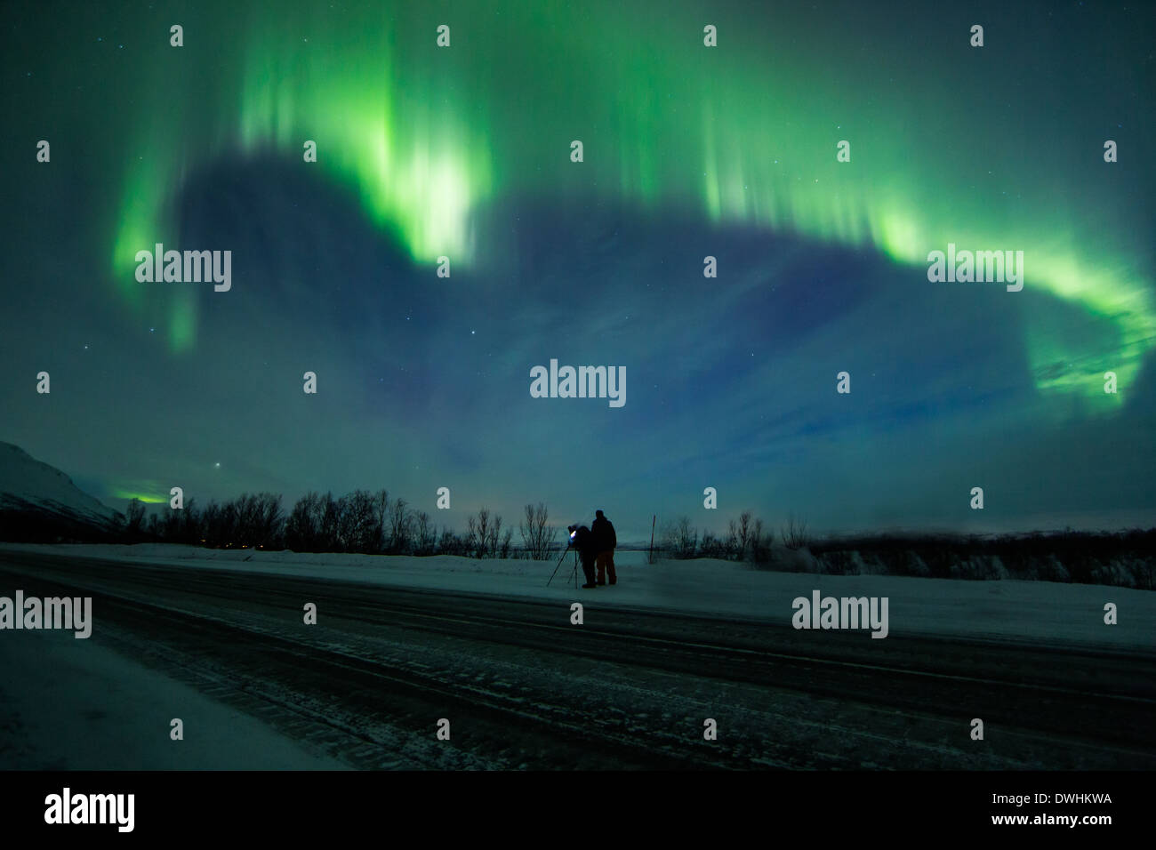 Northern lights (Aurora borealis) above snow scene Stock Photo - Alamy