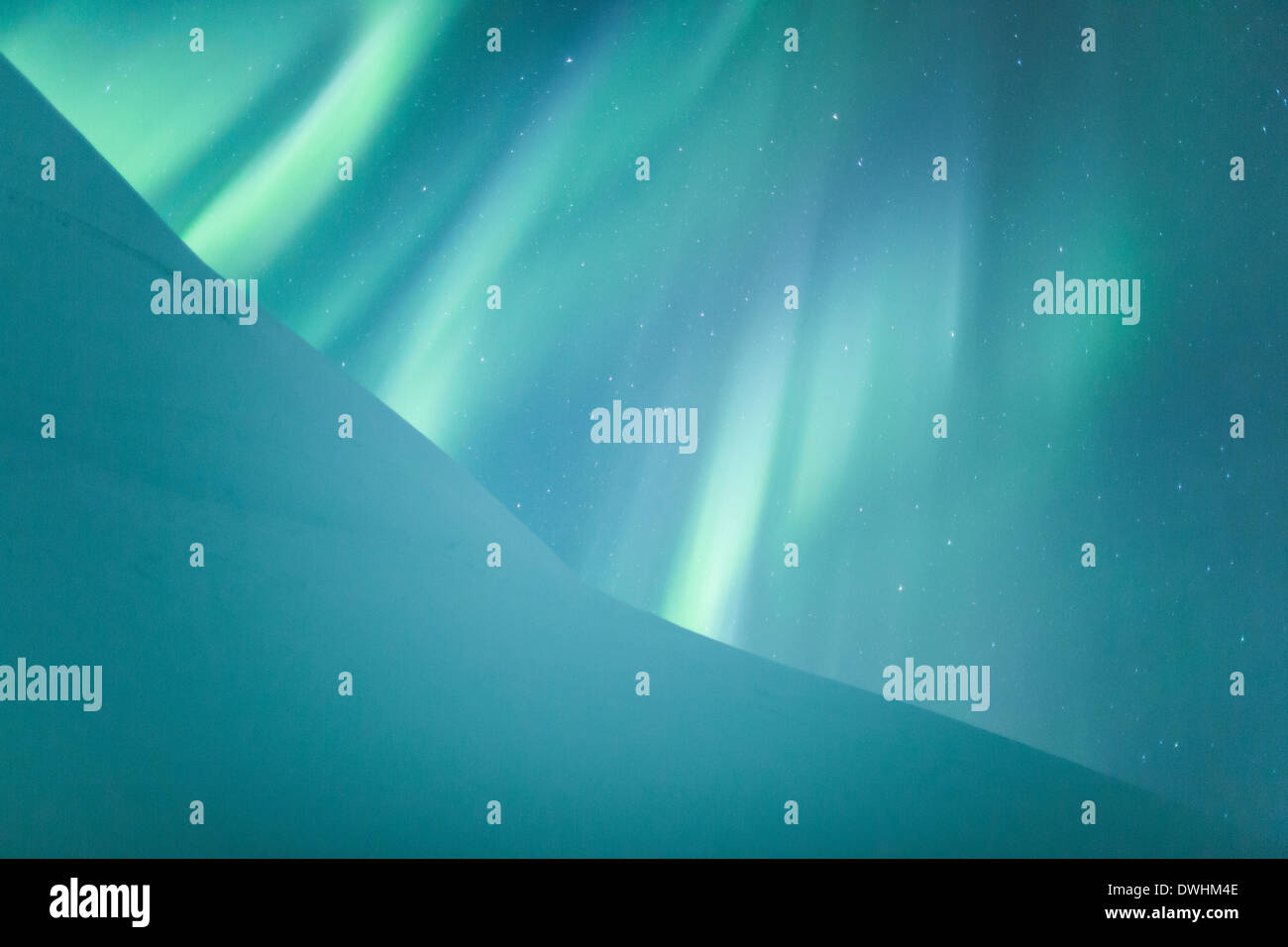 Northern lights (Aurora borealis) above snow scene Stock Photo - Alamy