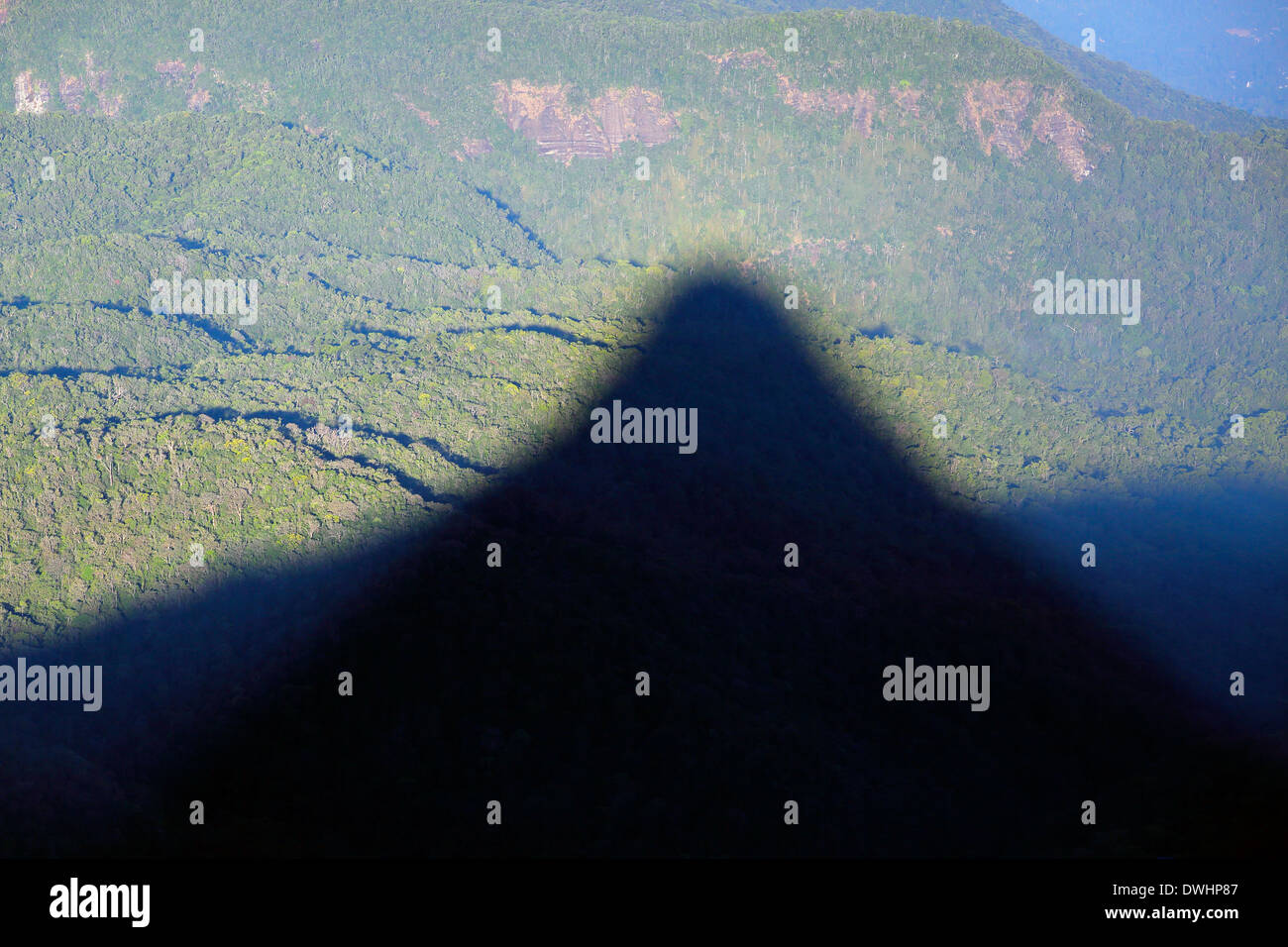 Early morning shadow of Adam's Peak (Sri Pada) cast over surrounding ...