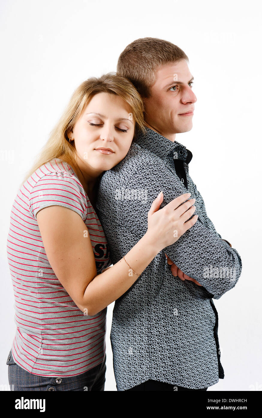 young woman hugging man from the back Stock Photo - Alamy