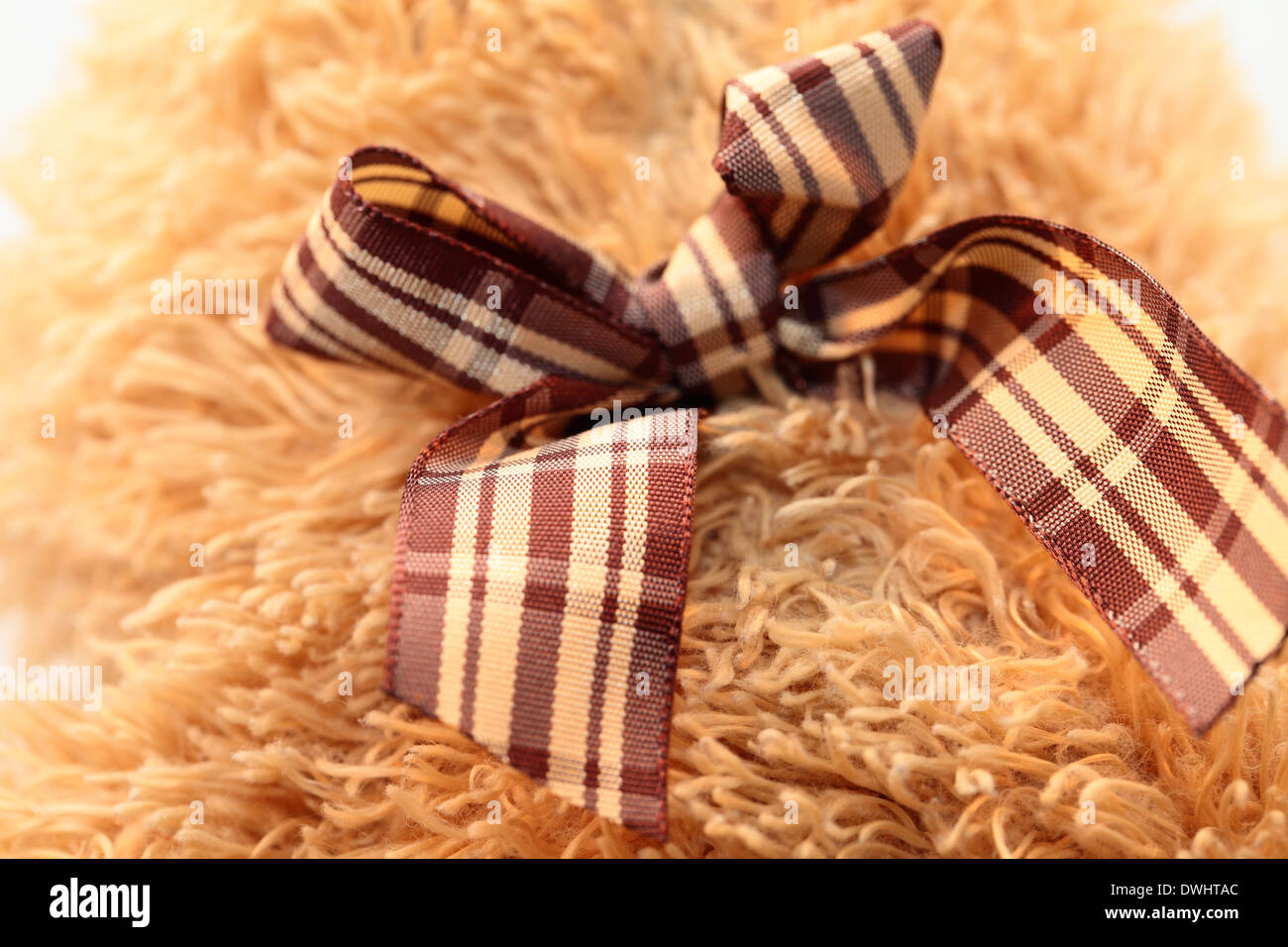 Satin bow on brown teddy bear Stock Photo - Alamy