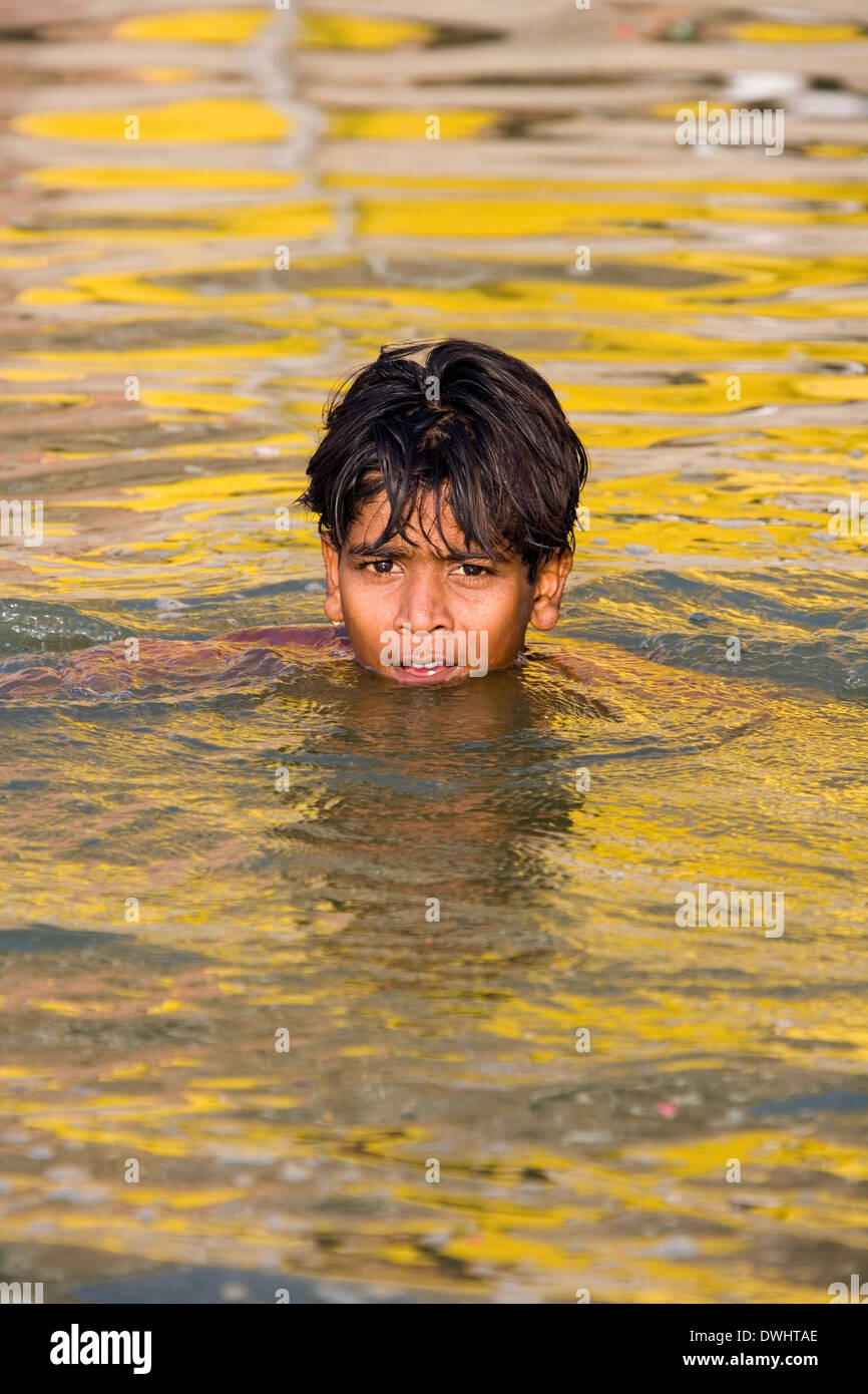 Indian boy in the Holy River Ganges - Varanasi - India Stock Photo - Alamy