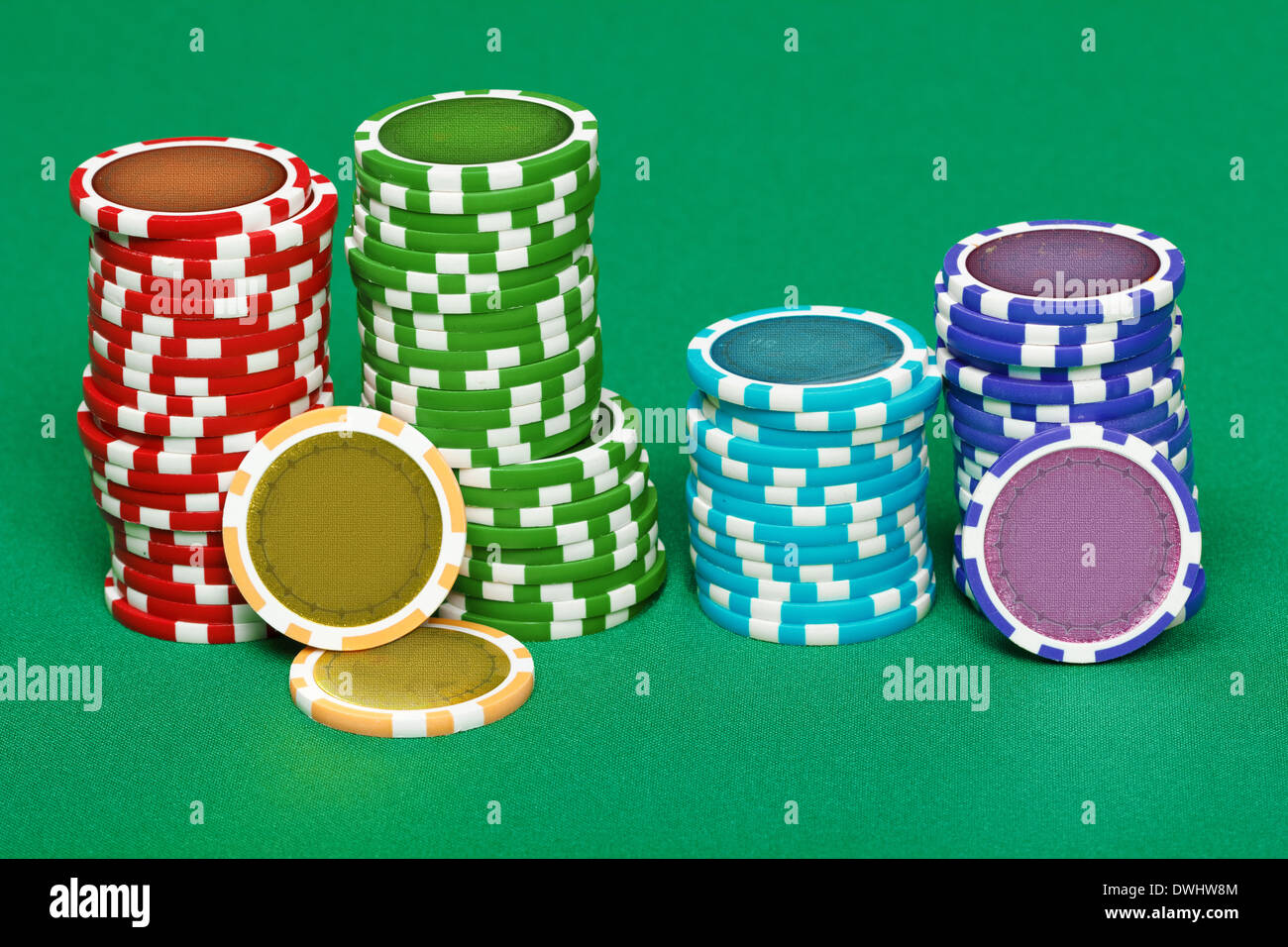 pile of playing chips on the green table Stock Photo - Alamy